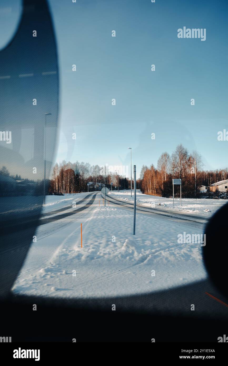 View out bus window of snowy Rovaniemi streets in winter in Lapland ...