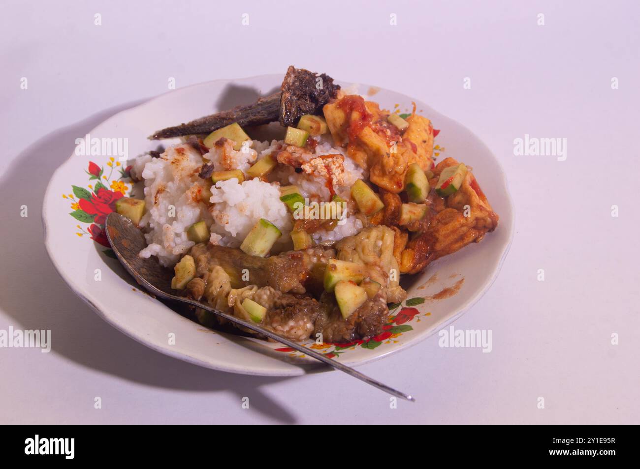 rice with pecel seasoning and side dishes such as eggs, tempeh or tofu ...