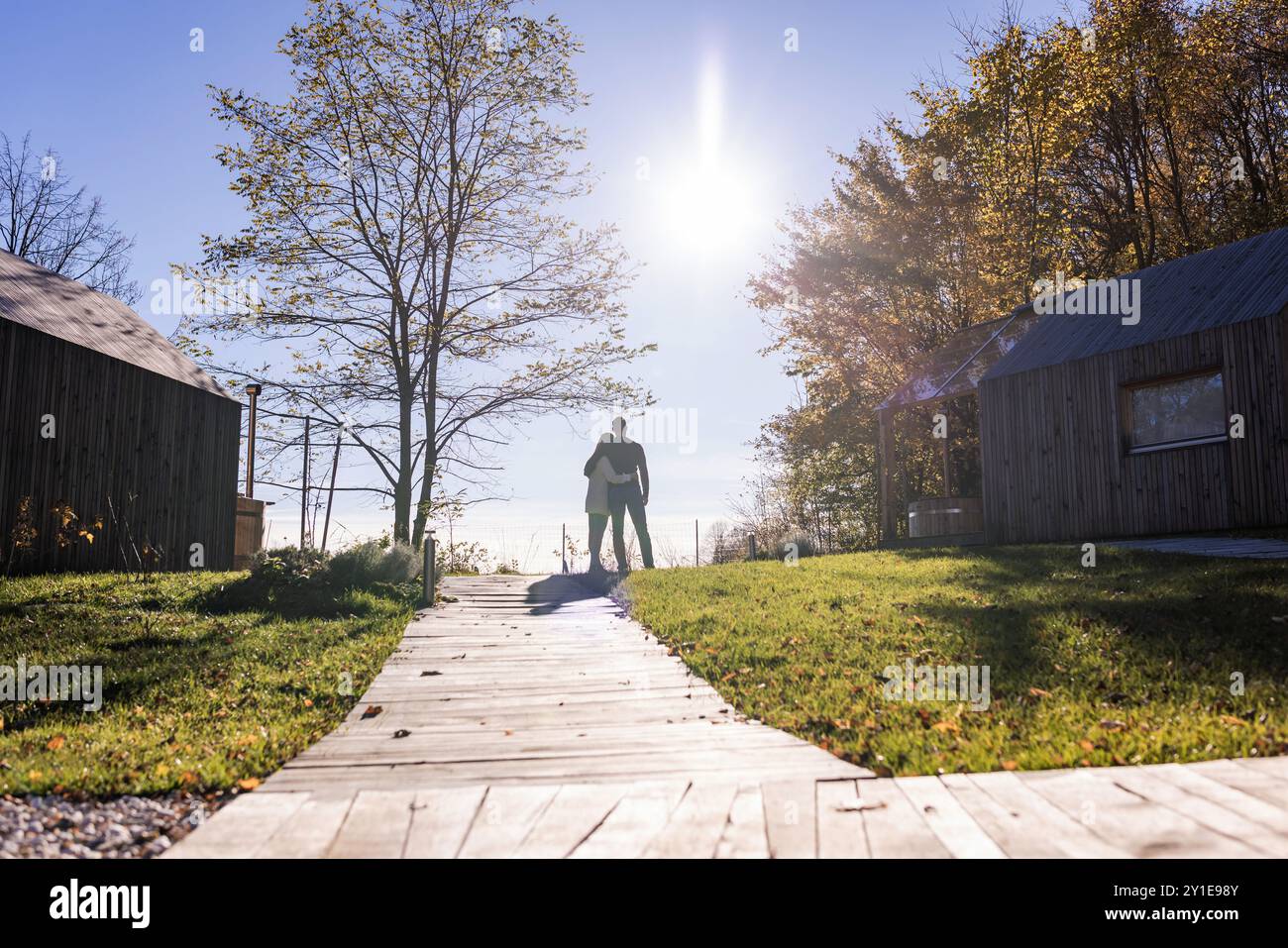 Loving couple relaxing walking through glamping center, enjoying nature ...