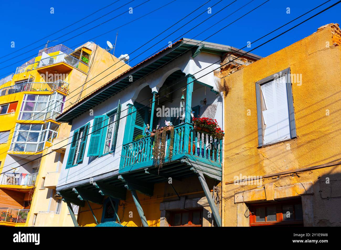 House featuring a balcony and a window, showcasing retro architectural ...