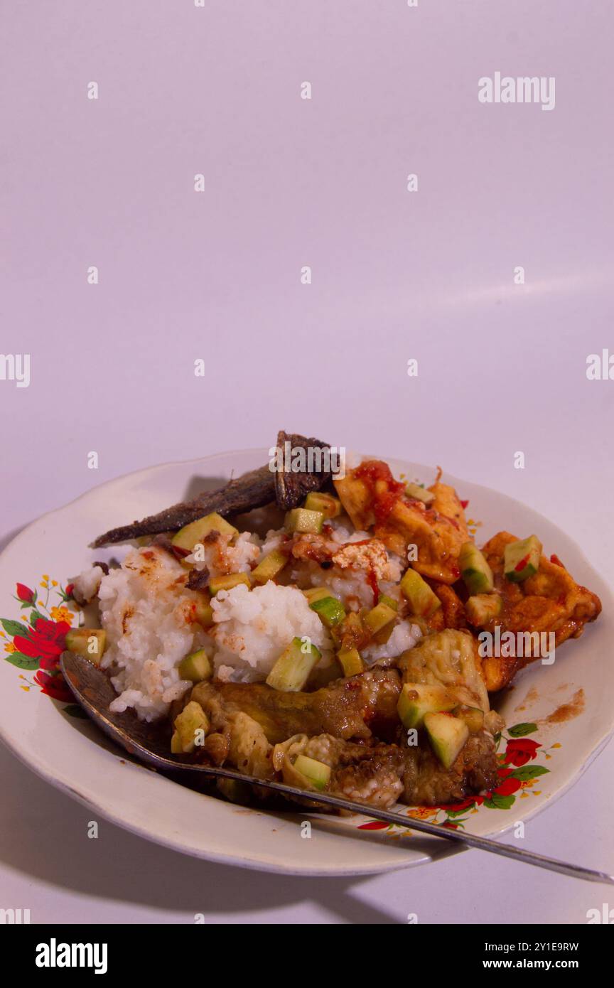 rice with pecel seasoning and side dishes such as eggs, tempeh or tofu ...