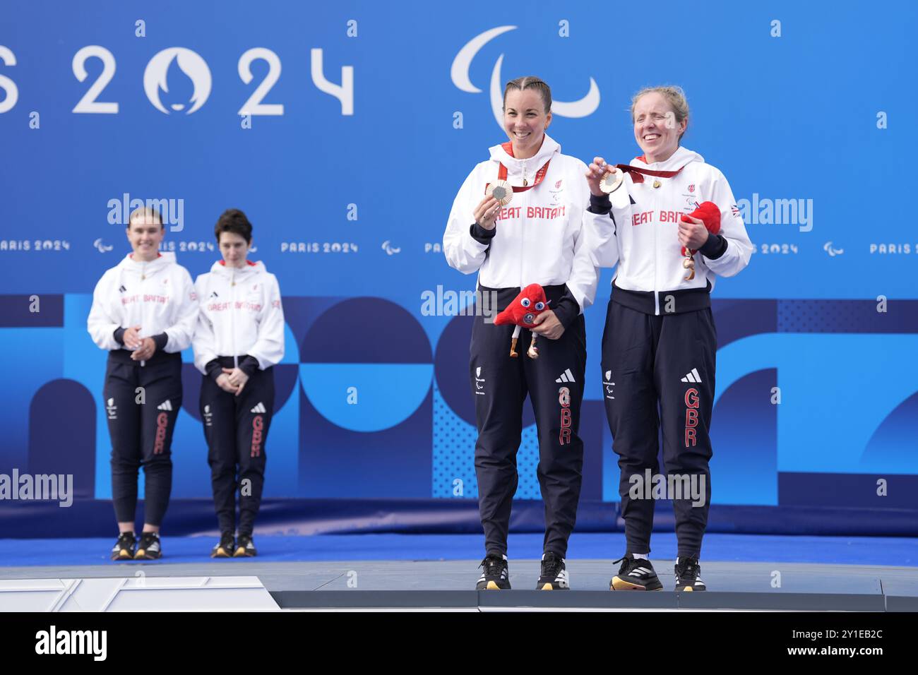 Bronze medallists Great Britain's Lora Fachie and pilot Corrine Hall ...