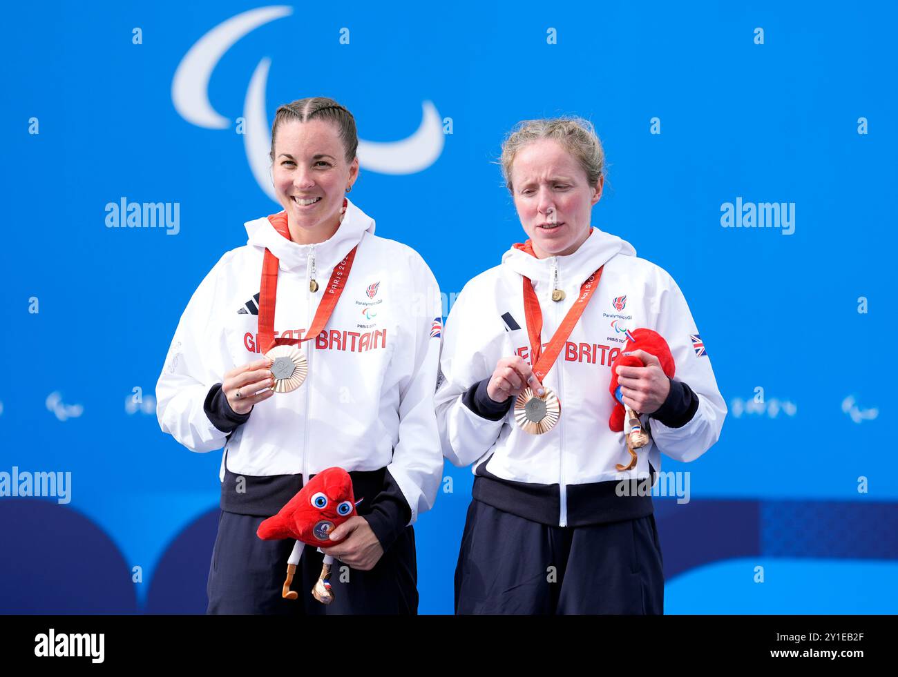 Bronze medallists Great Britain's Lora Fachie and pilot Corrine Hall ...