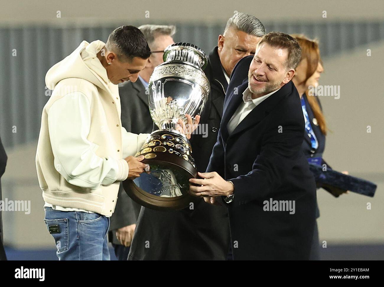 Argentina’s forward Angel Di Maria (L) receives a replica of the Copa ...