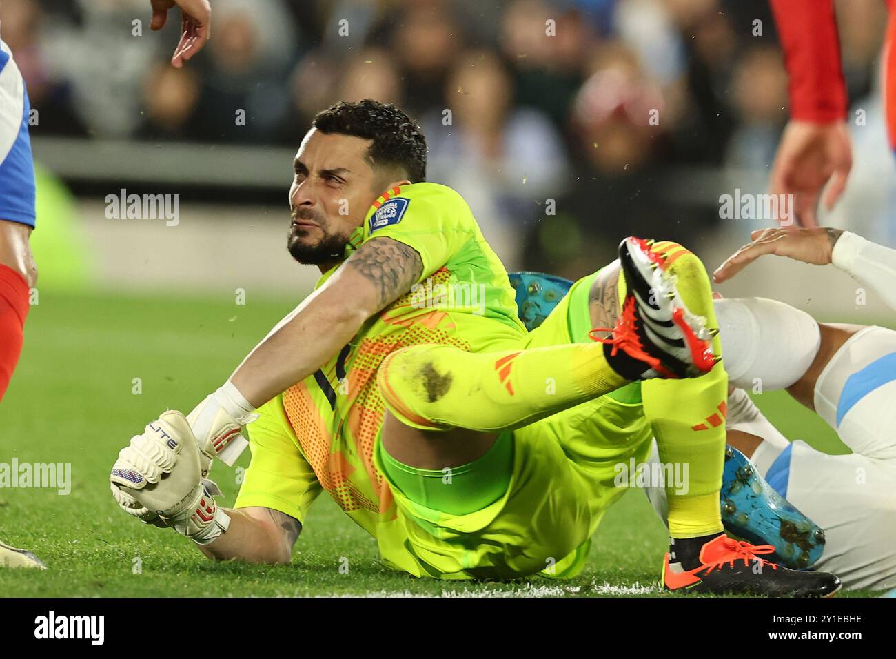 Chile's goalkeeper Gabriel Arias falls on the field after colliding ...
