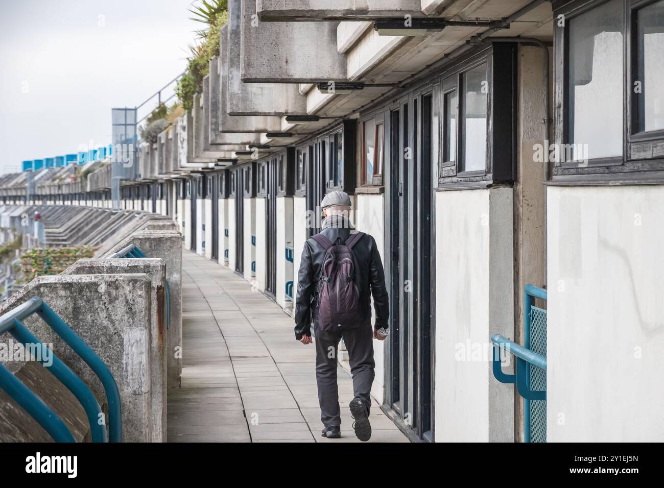 A man walking on the crescent walkway of Alexandra Road estate in ...