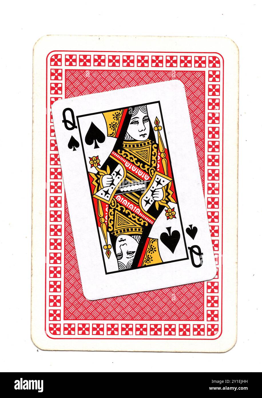 A vintage queen of spades playing card displayed on the back of another ...