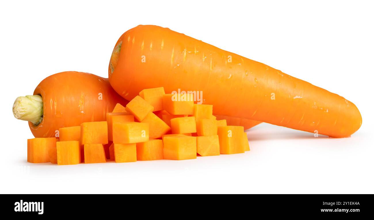 Side view of fresh orange carrot with slices in cube shape in stack is ...