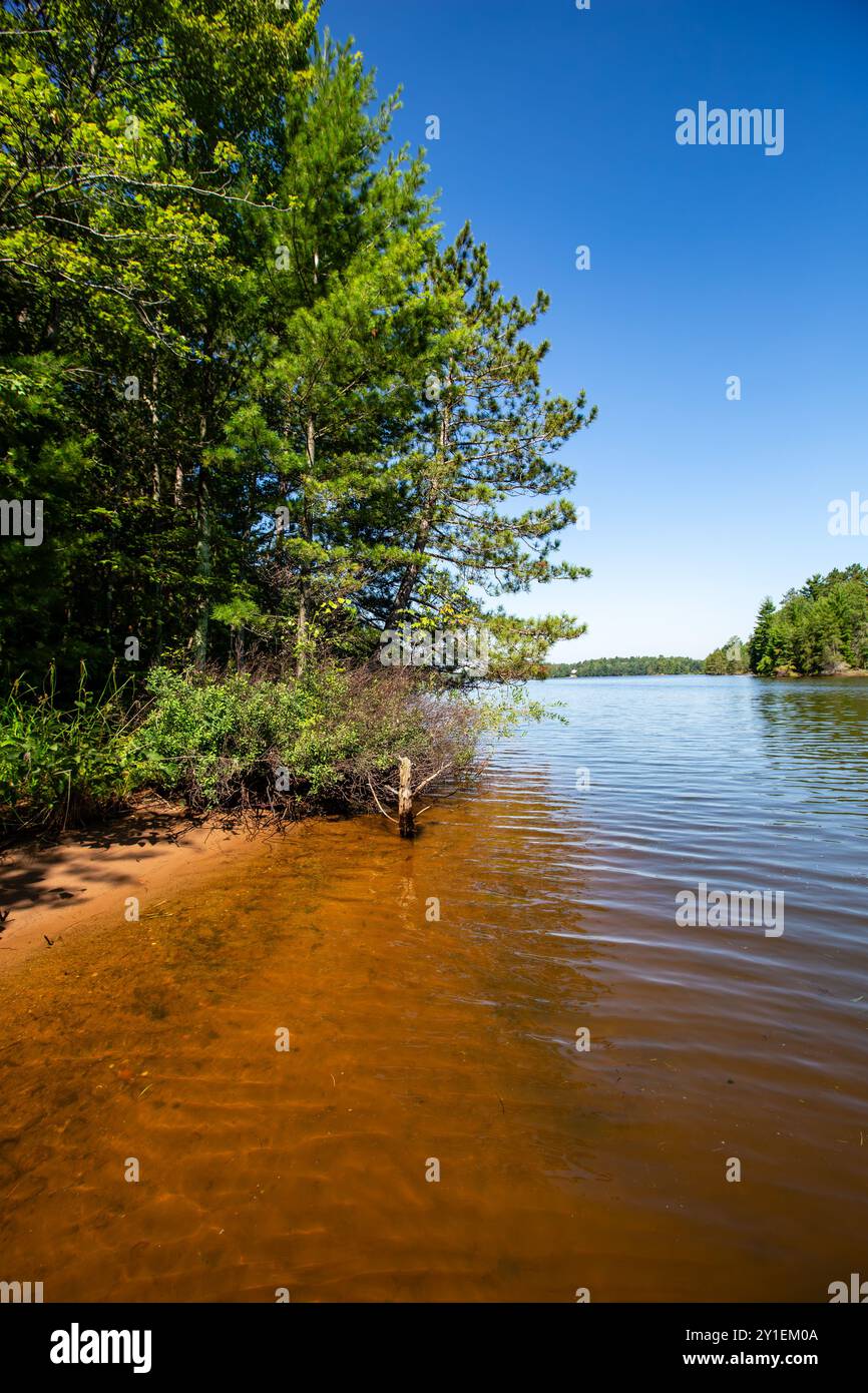 Lake Nokomis in Tomahawk, Wisconsin in the summer, vertical Stock Photo ...