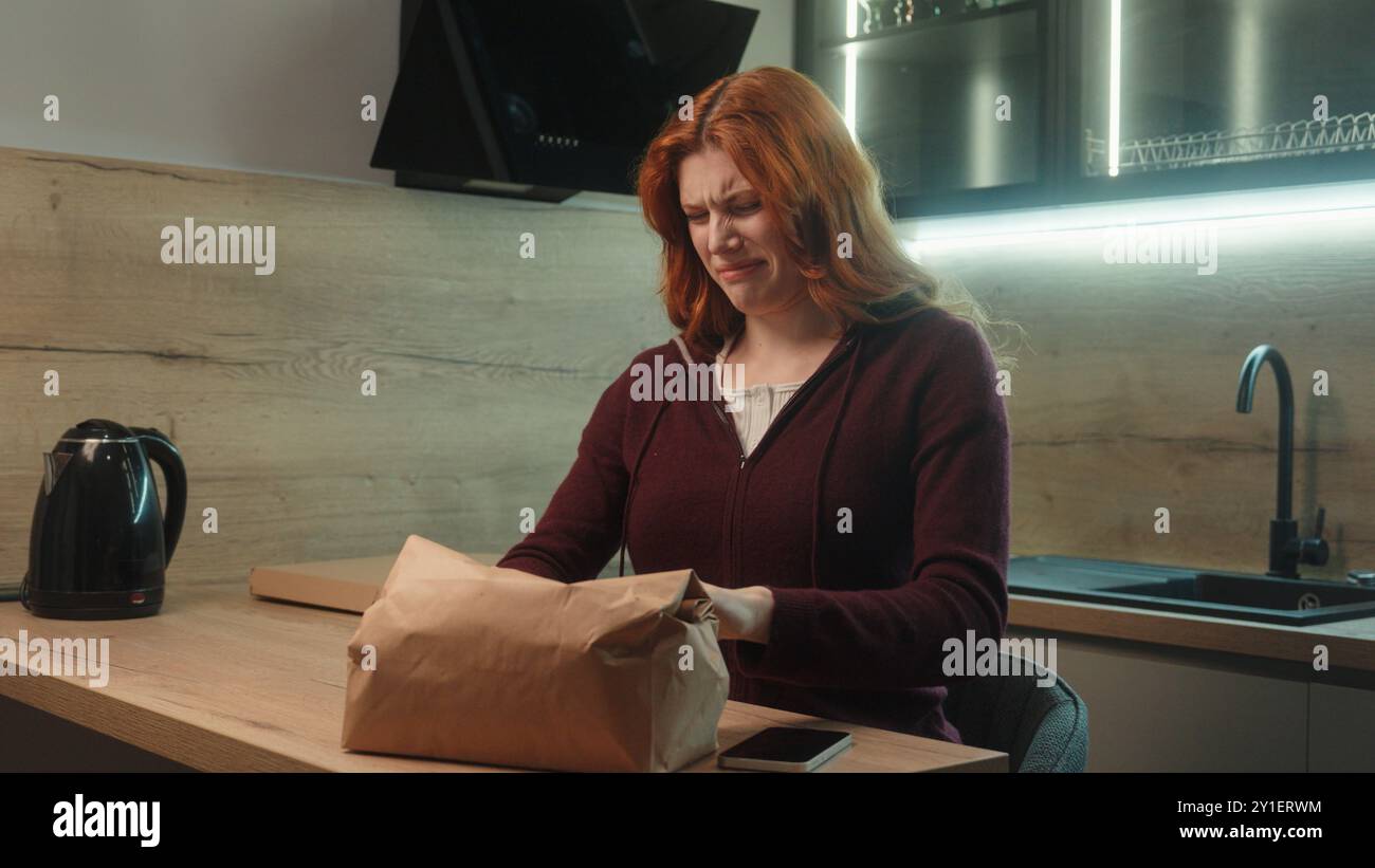 Woman smelling bad food hi-res stock photography and images - Alamy