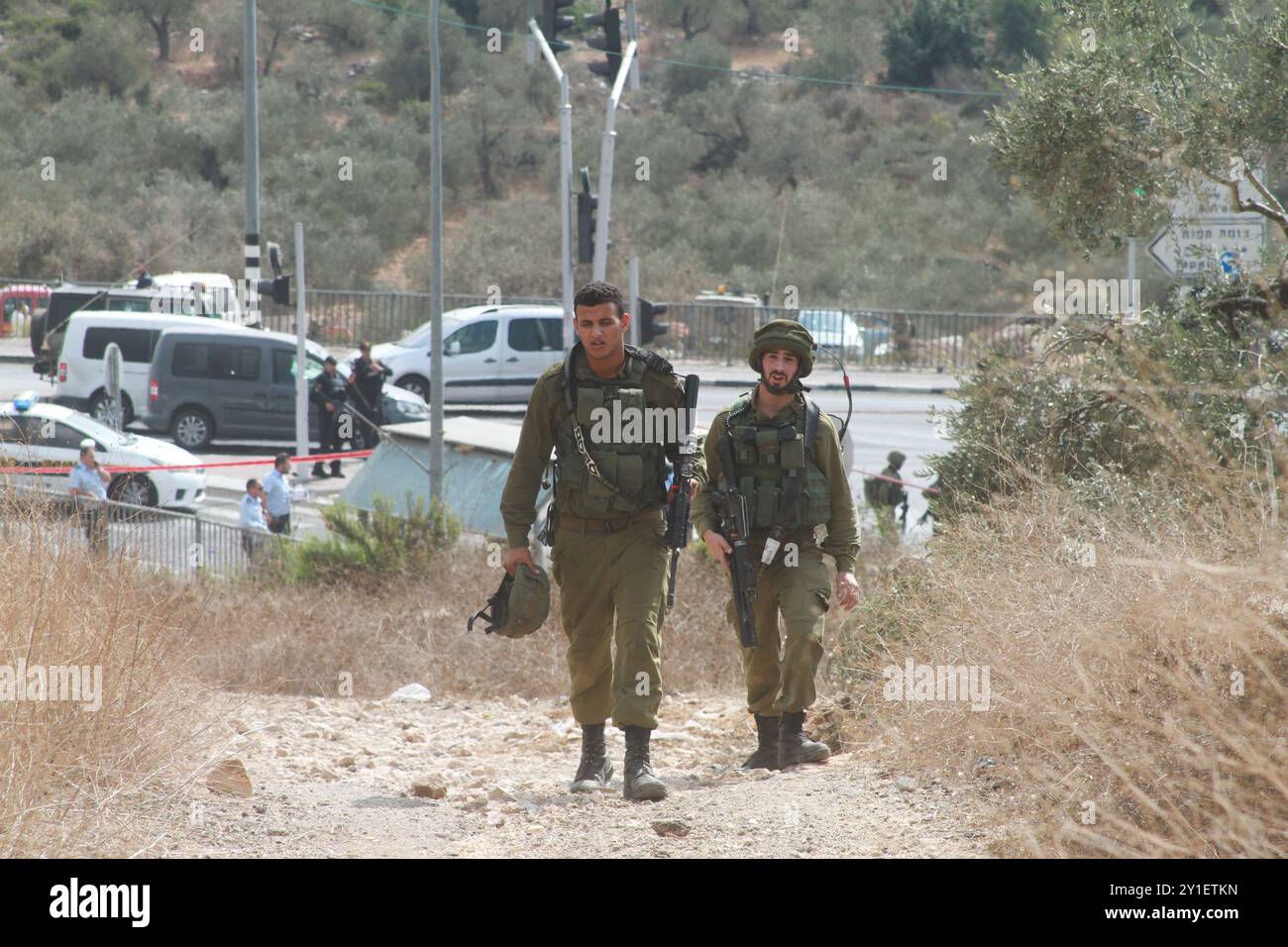 Israeli troops and police gather at a bus stop near the Ariel Israeli ...