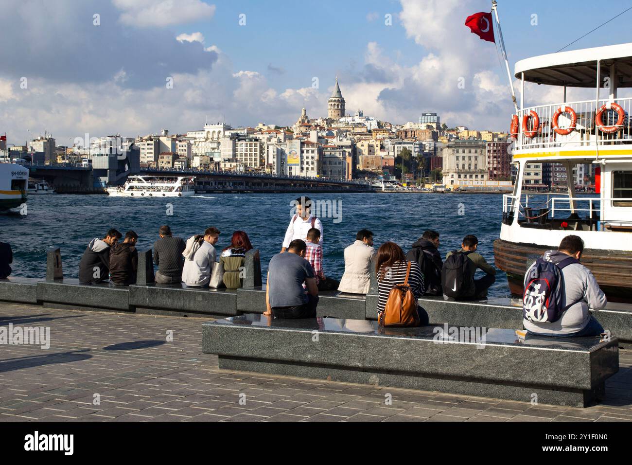 Serene waterfront promenade overlooking historic city skyline in turkey ...