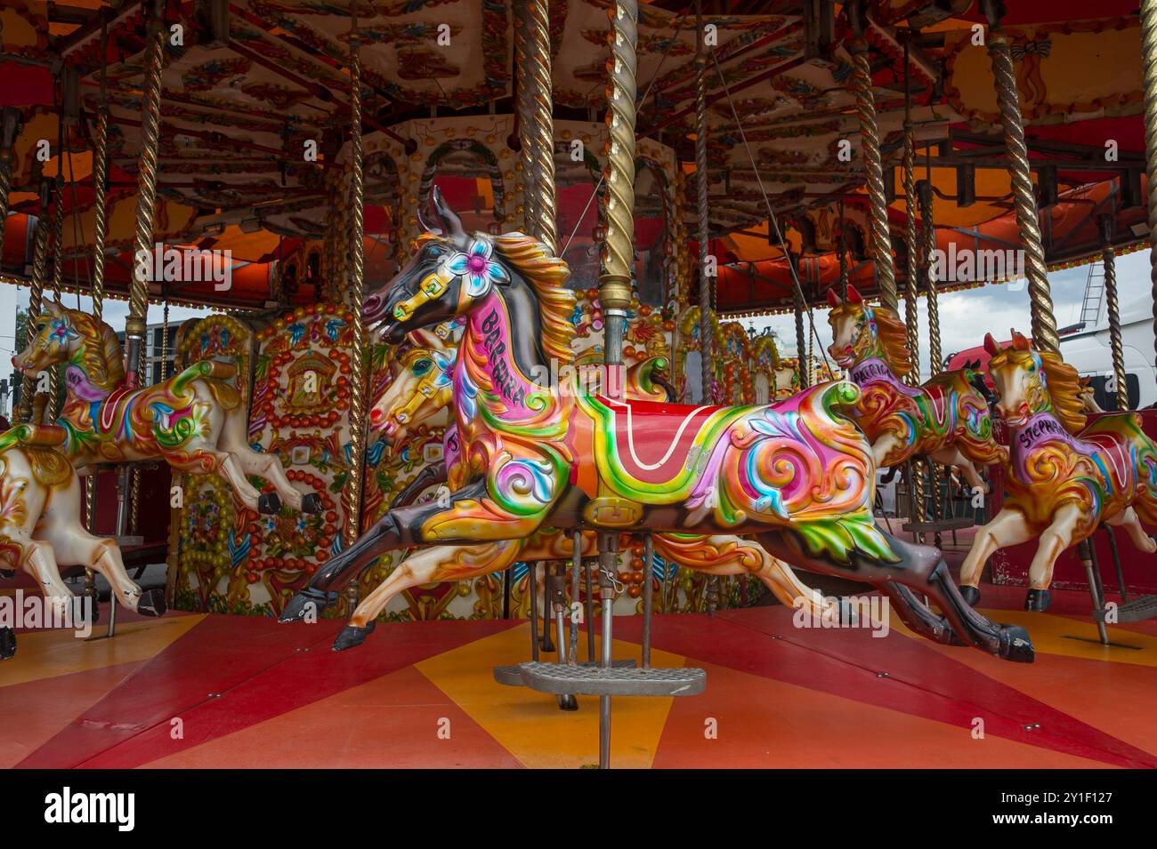 Vintage Carousel Attraction Ride With Wooden Horses Stock Photo - Alamy