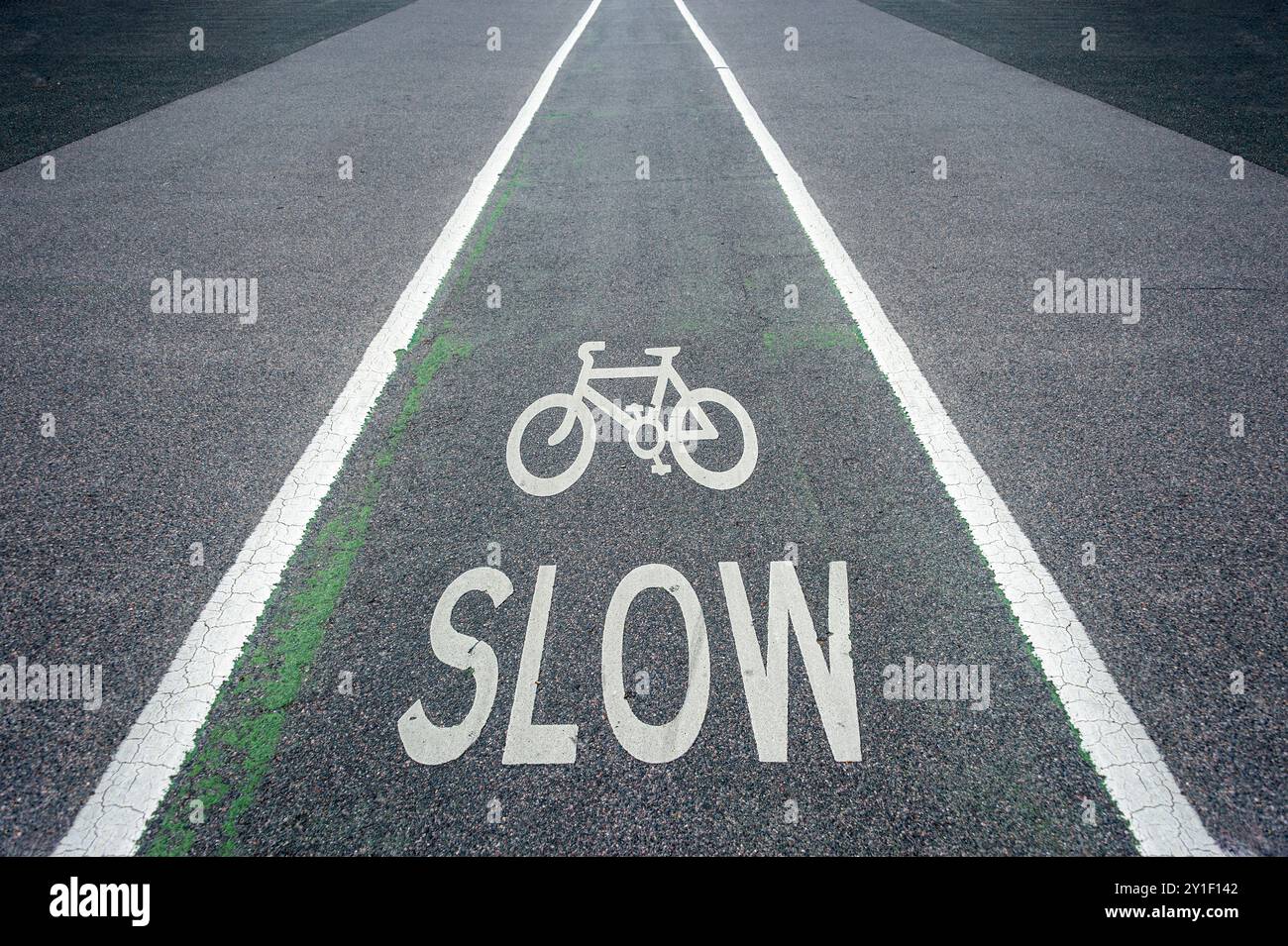 Road marking slow sign painted hi-res stock photography and images - Alamy