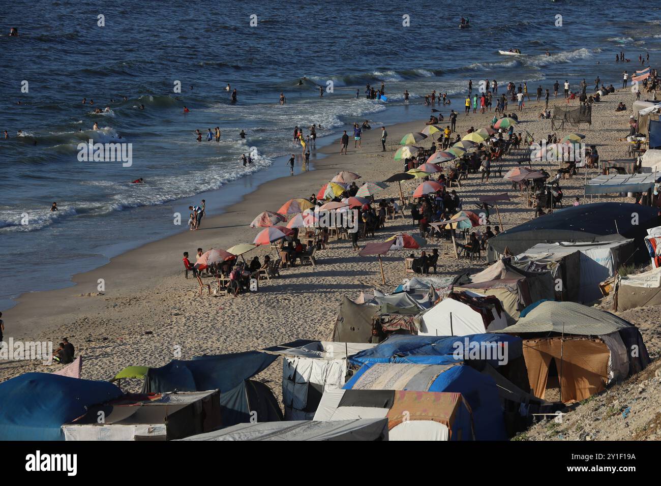 Tents are crammed together as displaced Palestinians camp on the beach ...