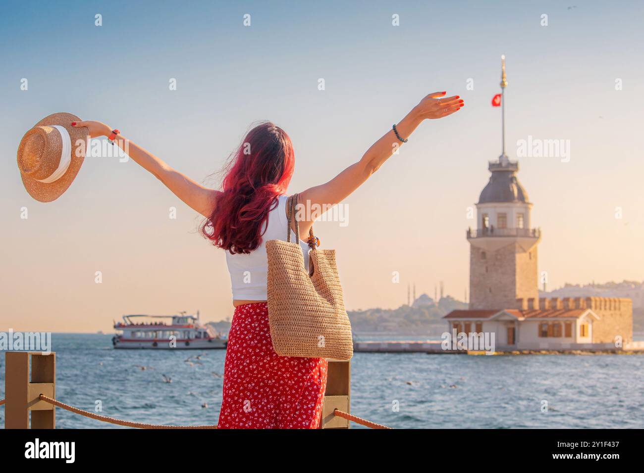 A female tourist explores Istanbul, admiring the iconic architecture of ...