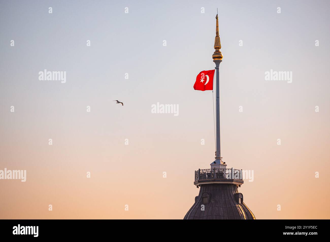 Turkish flag on a spire against sunset sky in Istanbul Stock Photo - Alamy