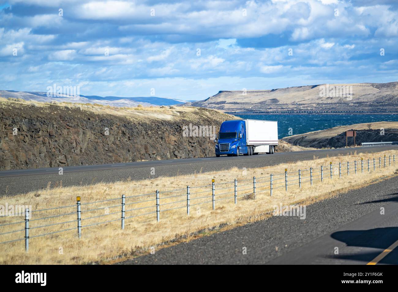 Industrial grade blue long haul big rig semi truck tractor with ...