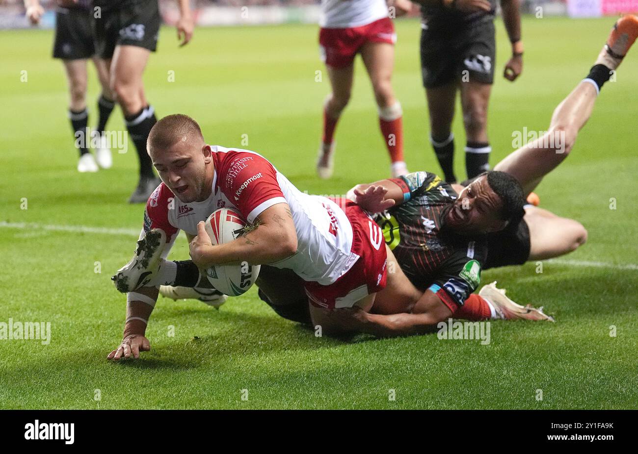 Hull KR's Mikey Lewis goes over for try against Wigan Warriors, during ...