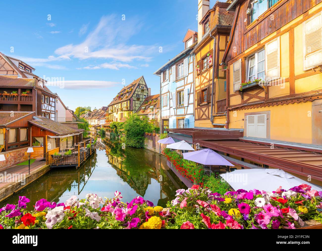 Picturesque, colorful half timber buildings with waterfront cafes along ...