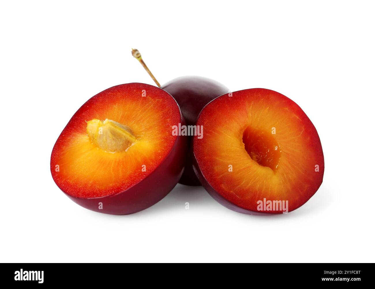 Whole and cut ripe plums isolated on white Stock Photo - Alamy