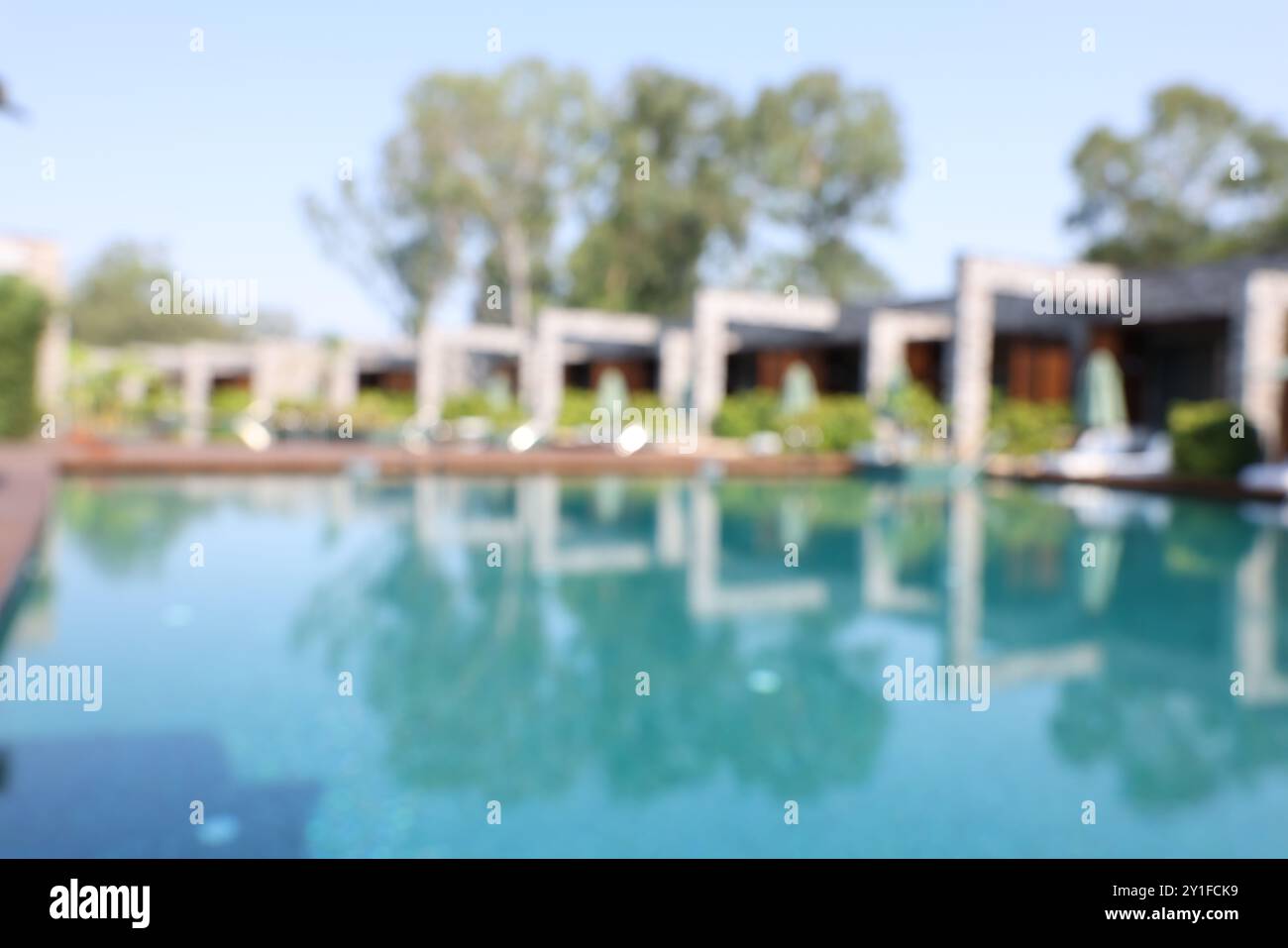 Blurred view of outdoor swimming pool at luxury resort Stock Photo - Alamy