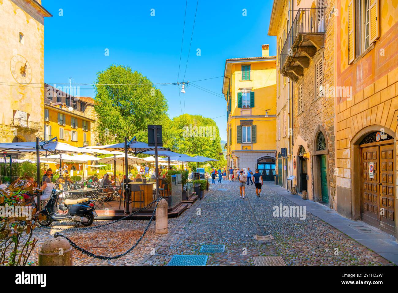 A picturesque street of shops and sidewalk cafes in the historic ...