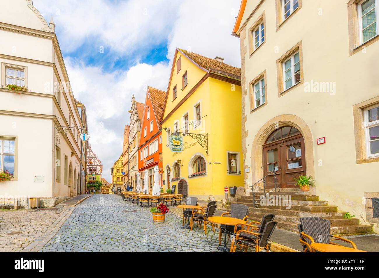A colorful cobblestone street along the main Marktplatz town square ...
