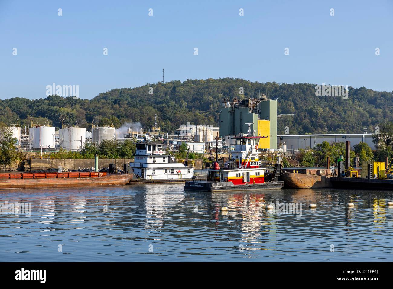The first industry towboat pushes barges through the newly-opened ...