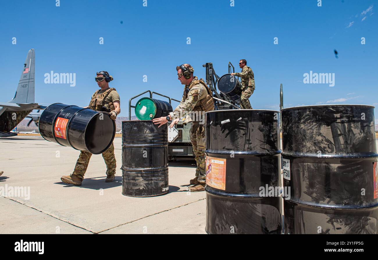 U.S. Airmen assigned to the 621st Contingency Response Squadron unload ...