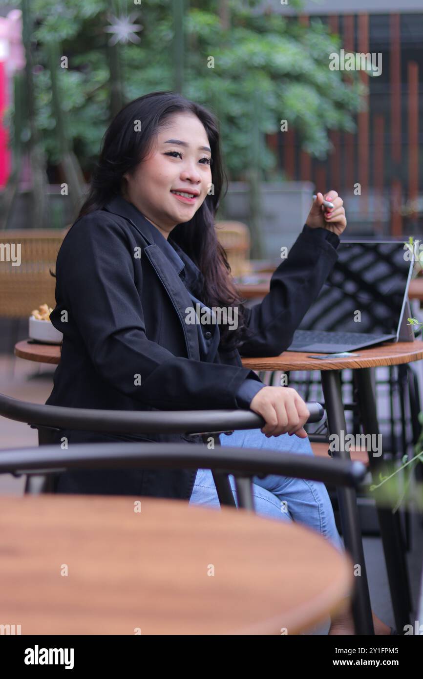 portrait of a beautiful candid Asian woman happy to get a gift from ...