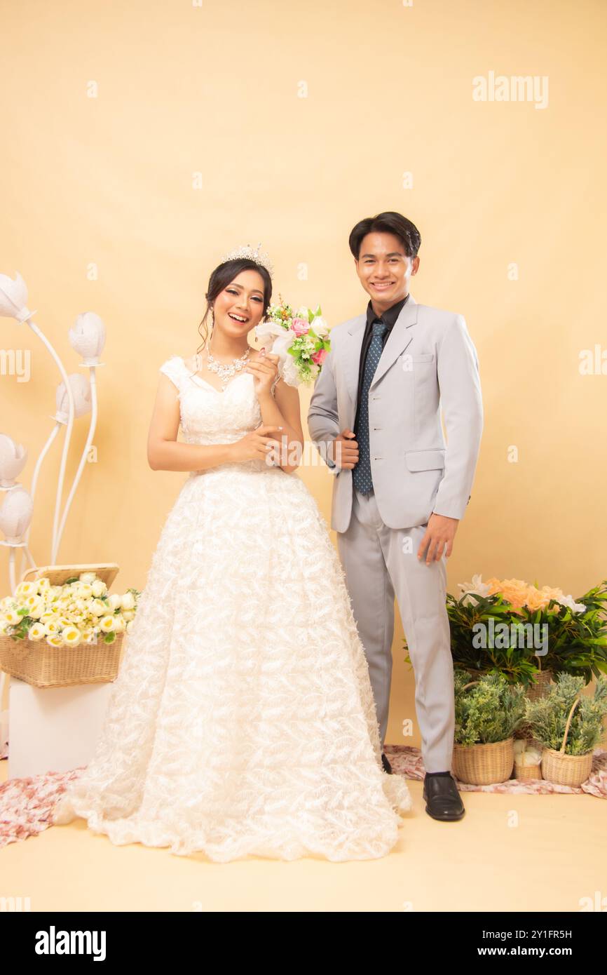 cheerful expression male and female couple in formal poses standing ...