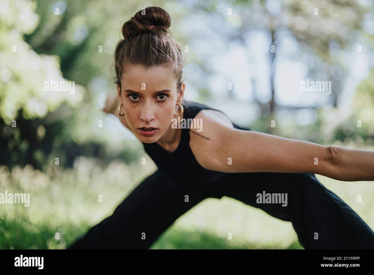 Lovely girl dancing in nature, focused female dancer performing modern dance outdoors Stock ...