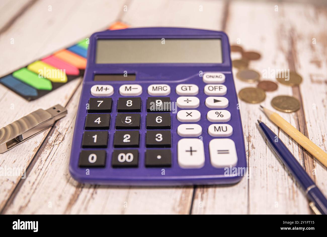 Blue digital calculator on a white background. Top view with place to ...
