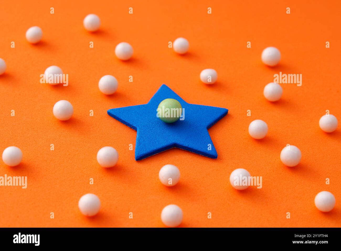 Leader guiding a group of spheres from the surface of a star Stock ...