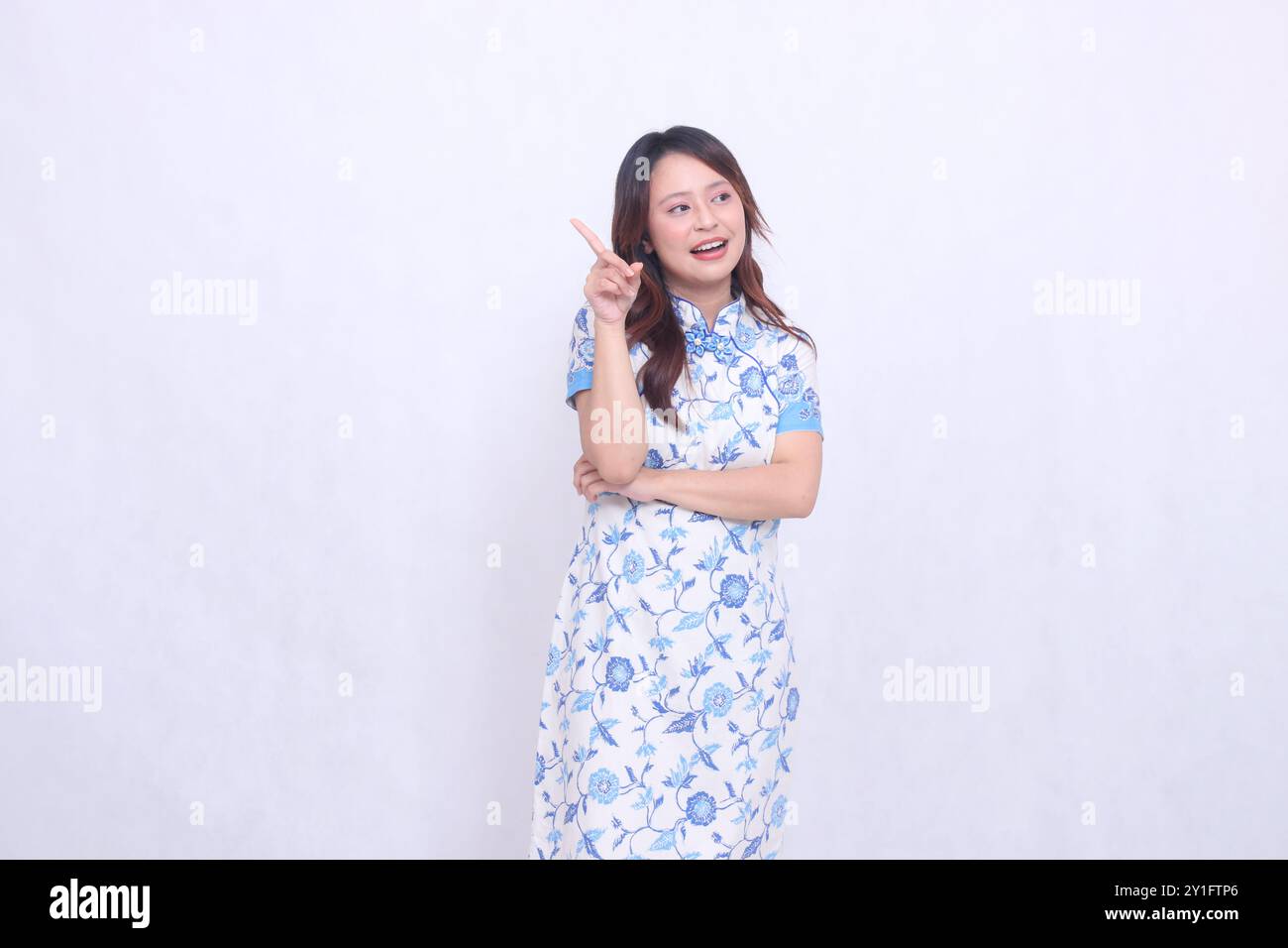 Beautiful Chinese Javanese woman smiling to the left wearing a modern ...
