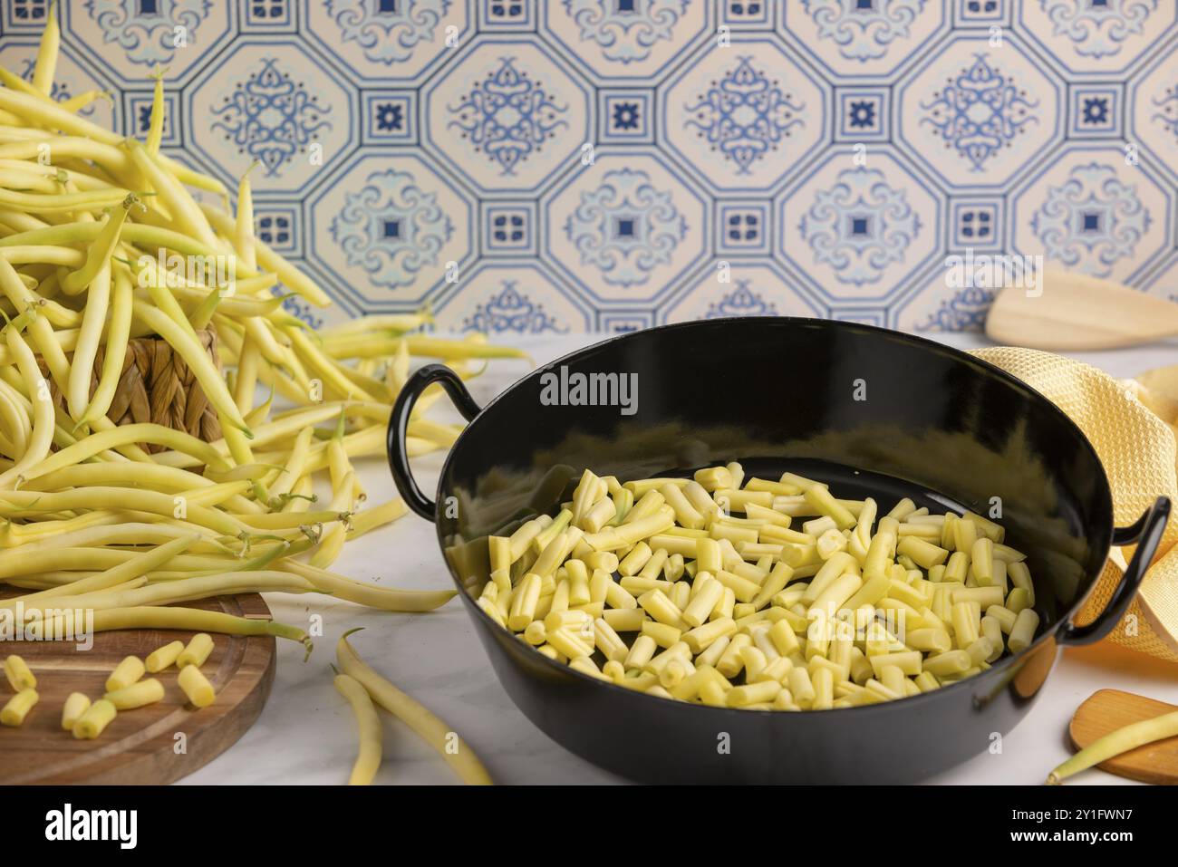 A cooking pot full of sliced beans on a kitchen worktop, whole runner ...