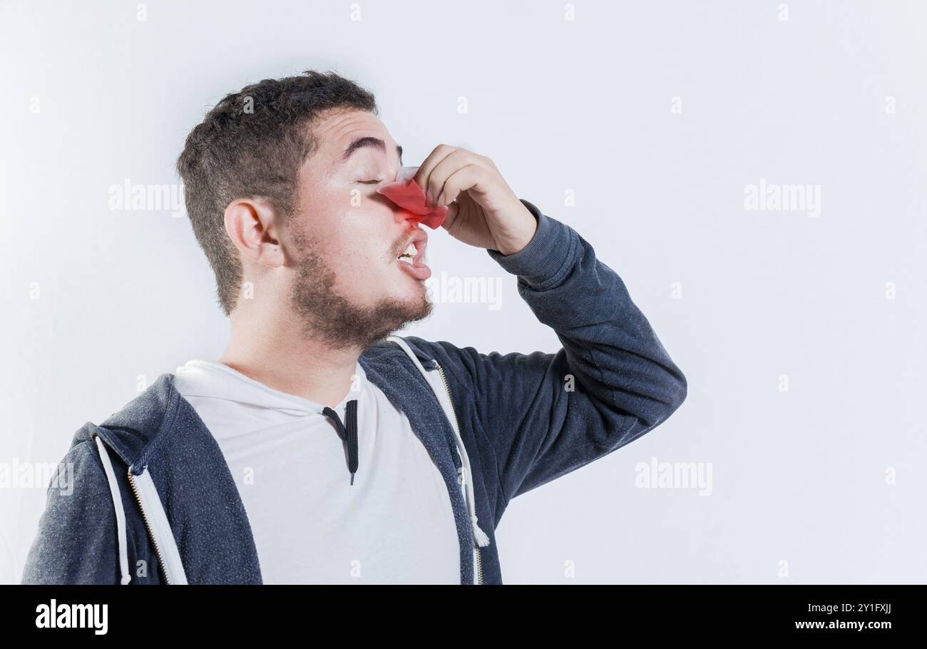 Person with nosebleed isolated. Concept of nasal congestion Stock Photo ...