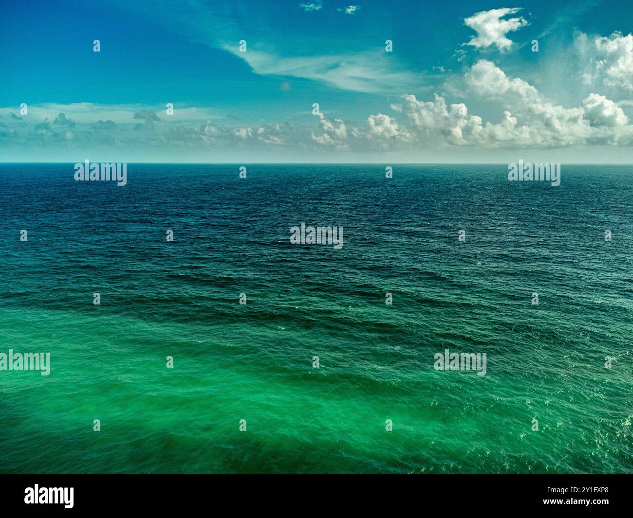 A stunning view of the open ocean, where the deep blue water meets the ...
