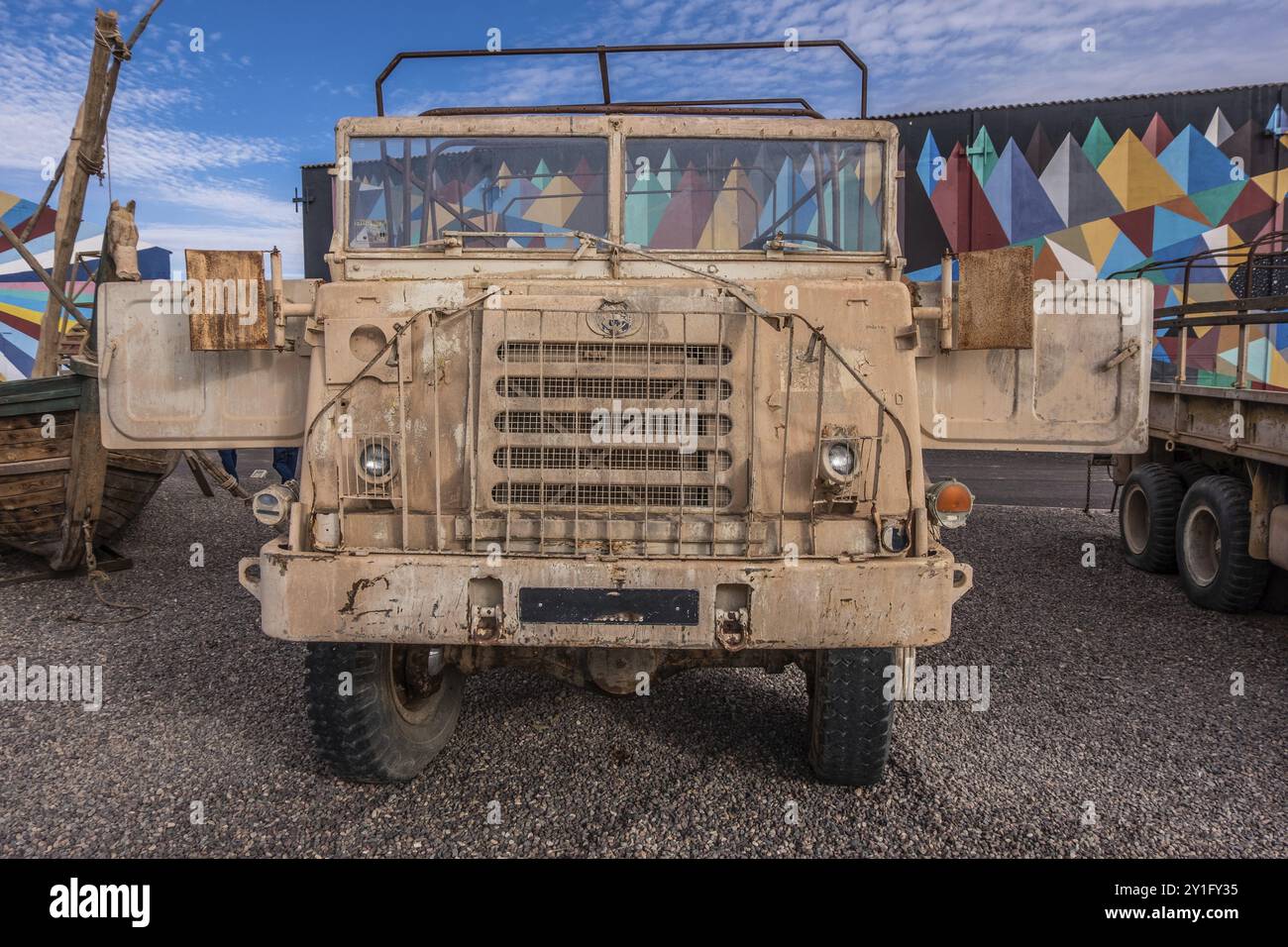 Abandoned and rusty military vehicles in the middle of the desert in ...