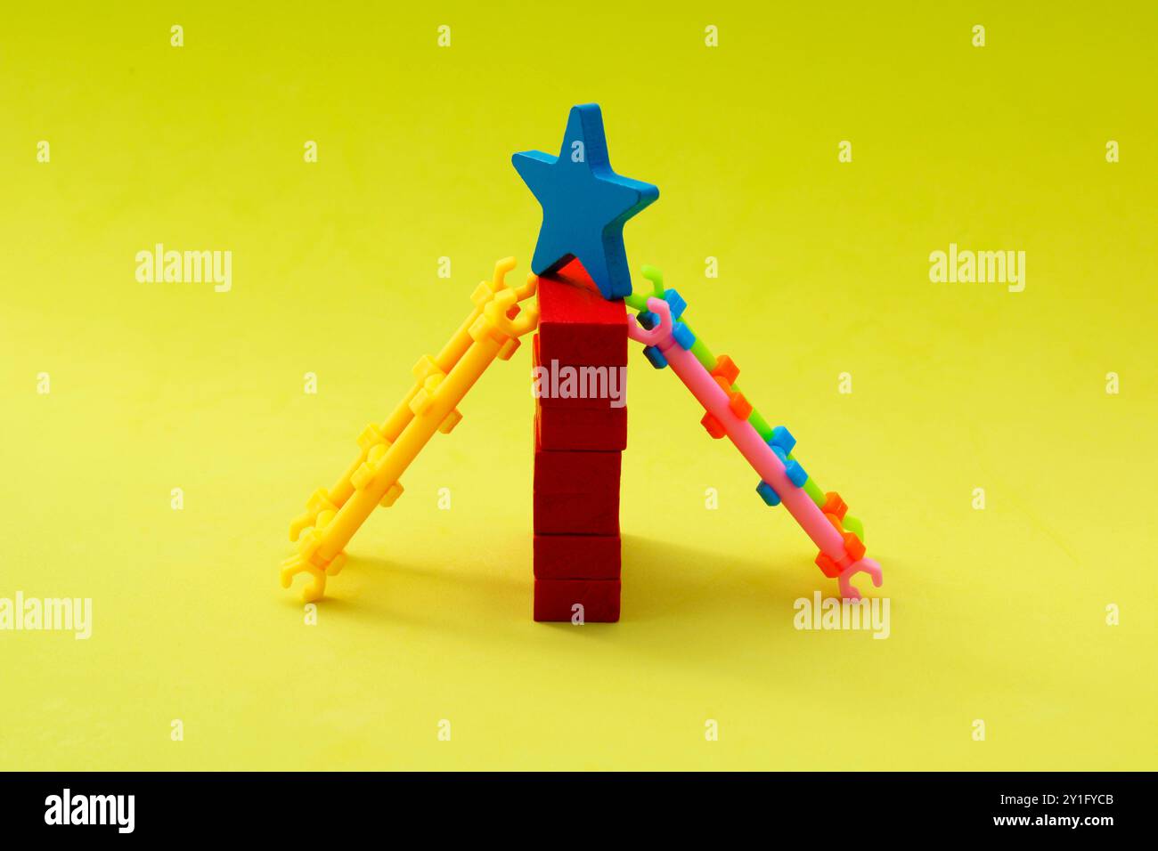 Two ladders that help a star leader to achieve a goal Stock Photo - Alamy