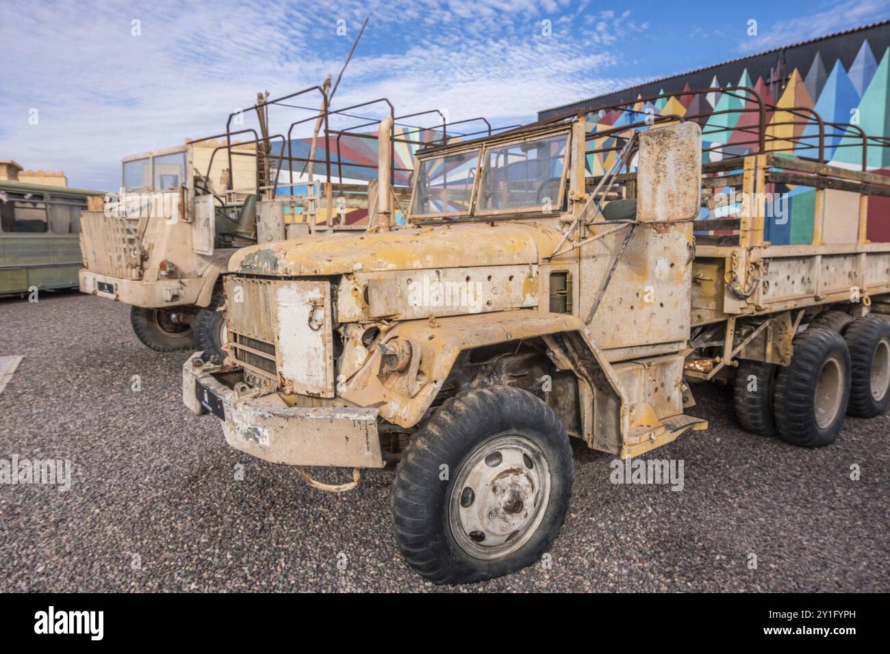 Abandoned and rusty military vehicles in the middle of the desert in ...