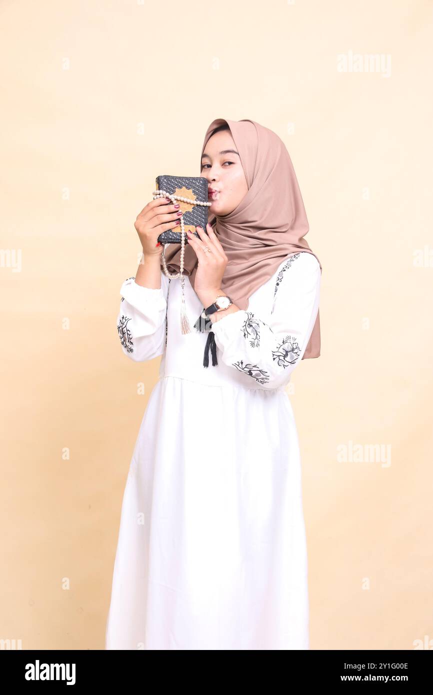 beautiful indonesia Muslim mature woman in hijab expression kissing ...