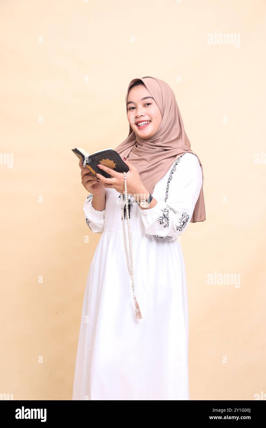 beautiful indonesia Muslim mature woman in hijab candid smiling at the ...