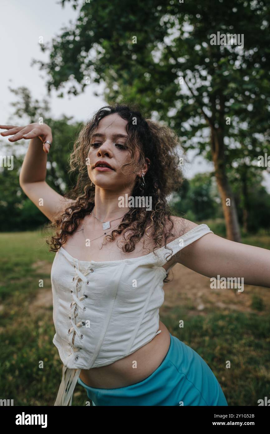 Happy young girl dancing freely in nature with joy and energy Stock ...
