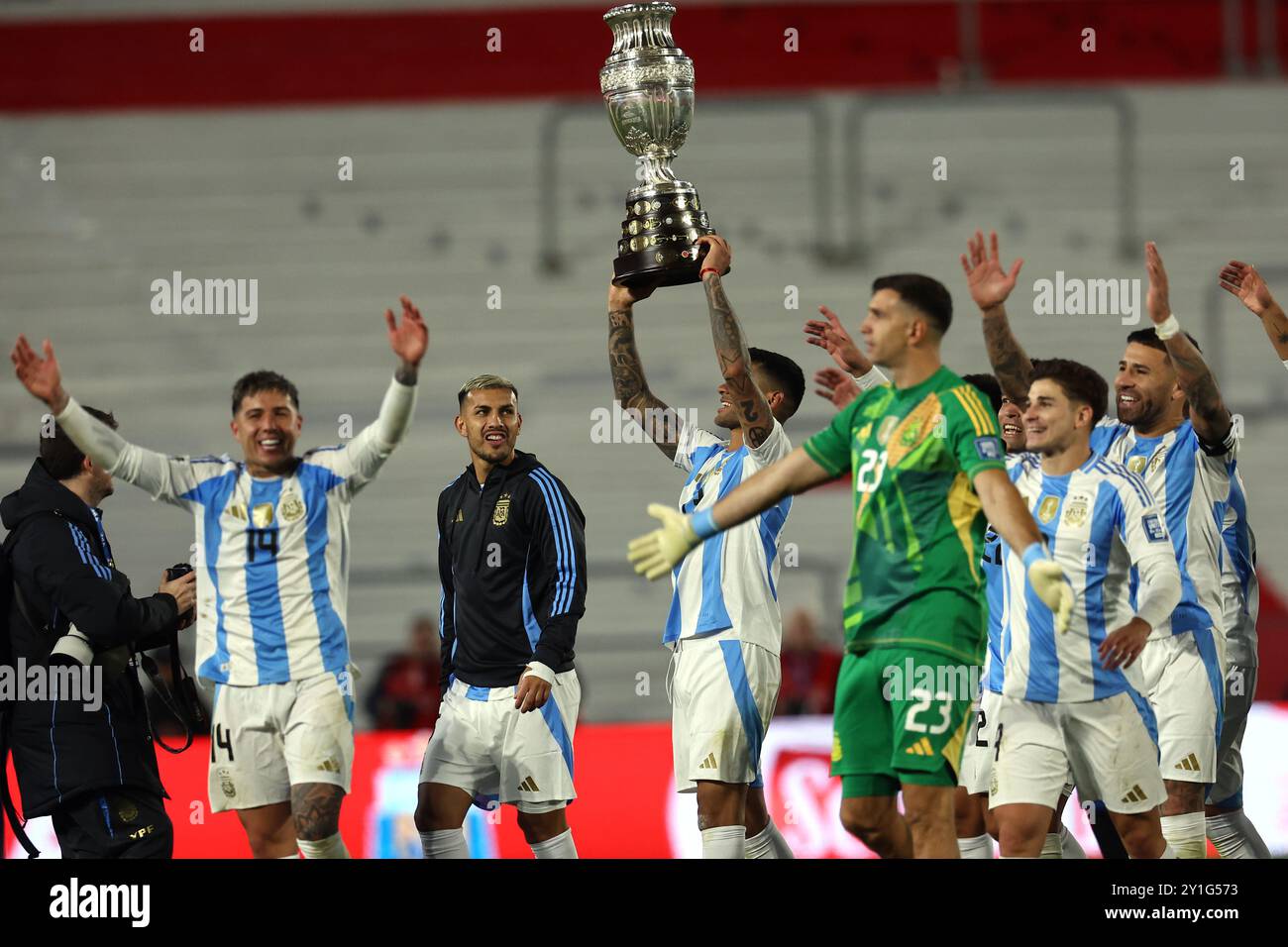 Argentina’s players celebrate and show the Copa America trophy as ...