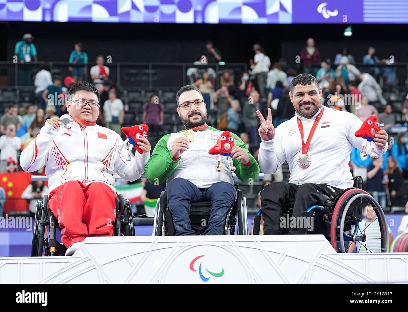 Paris, France. 6th Sep, 2024. Gold medalist Roohallah Rostami (C) of ...