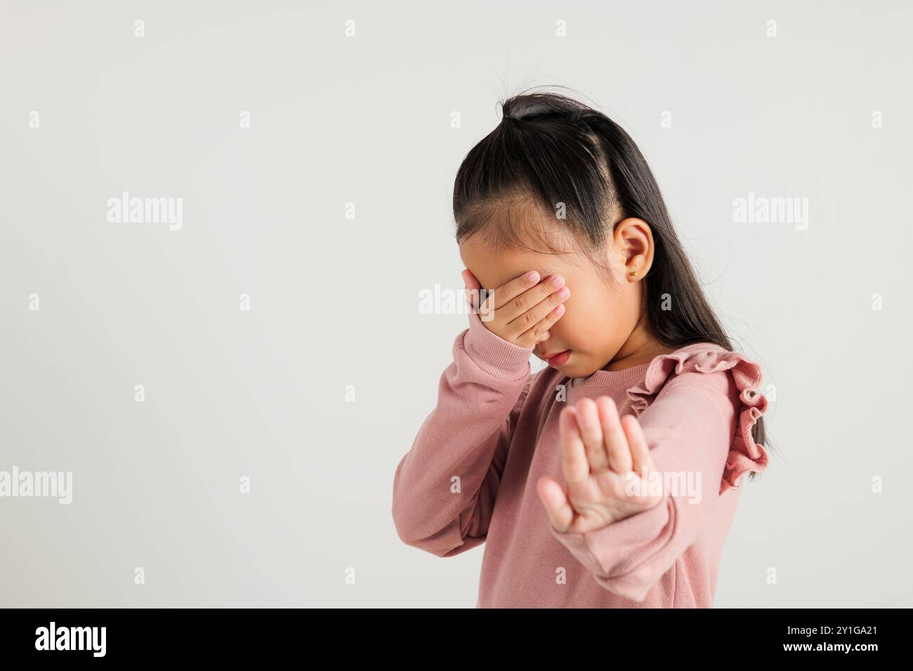 Stop hand of kindergarten child. Asian little kid girl doing stop sing ...