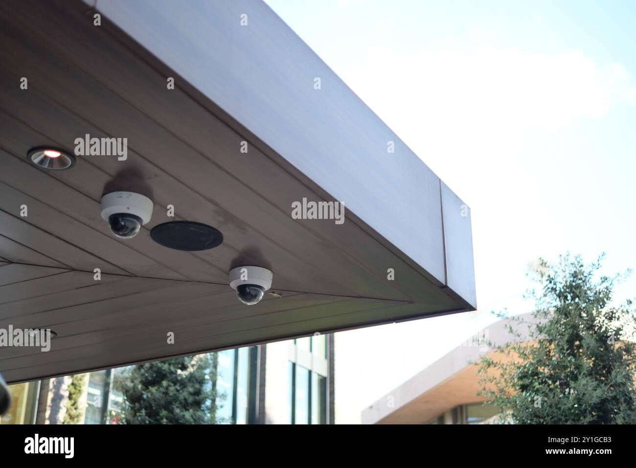 Surveillance cameras are installed under the roof overhang for enhanced ...