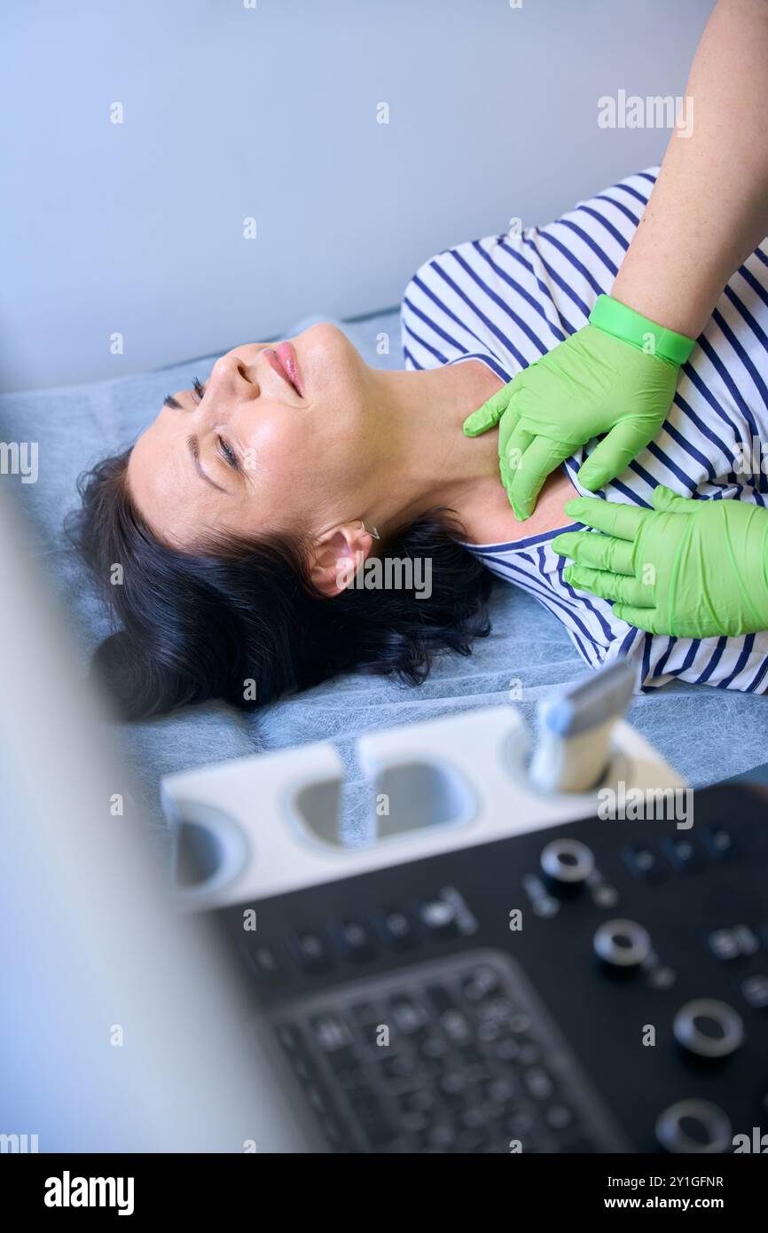 Doctor checks the lymph nodes of a middle-aged patient Stock Photo - Alamy